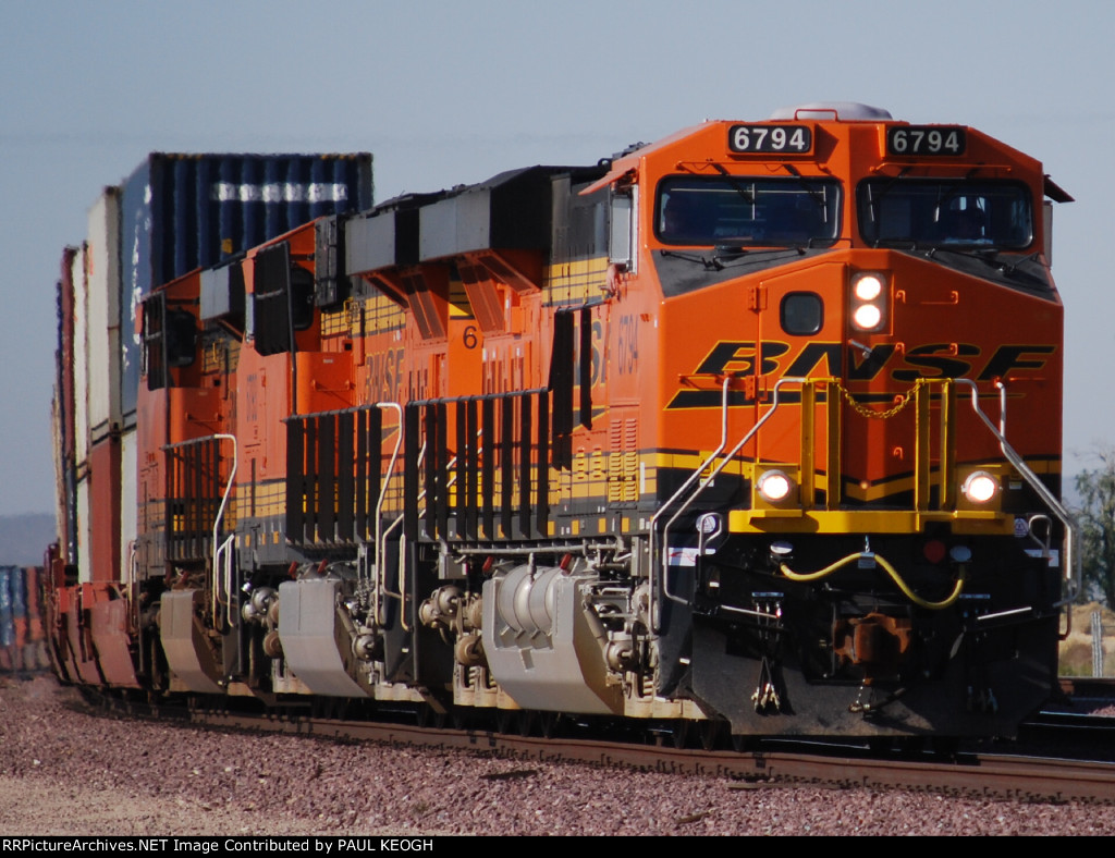 Zoom in shot of BNSF 6794 and BNSF 6793 as they head into BNSF Barstow.